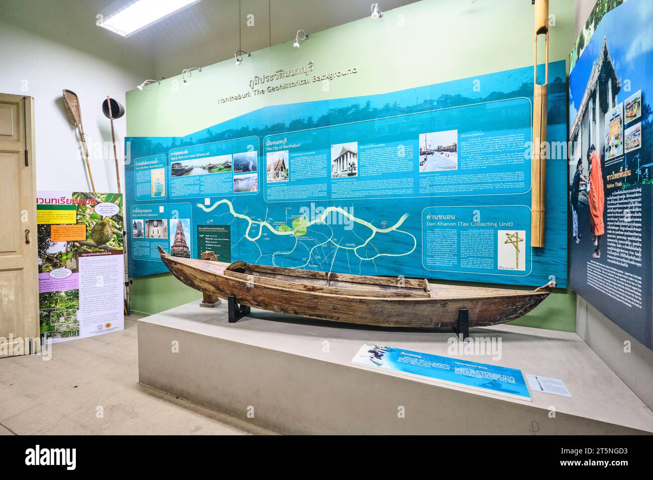 An exhibit, display that features an old wood canoe, boat. At the local ...