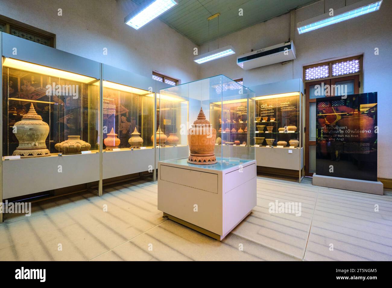 A room exhibiting classic clay pots and other clay artifacts. At the ...