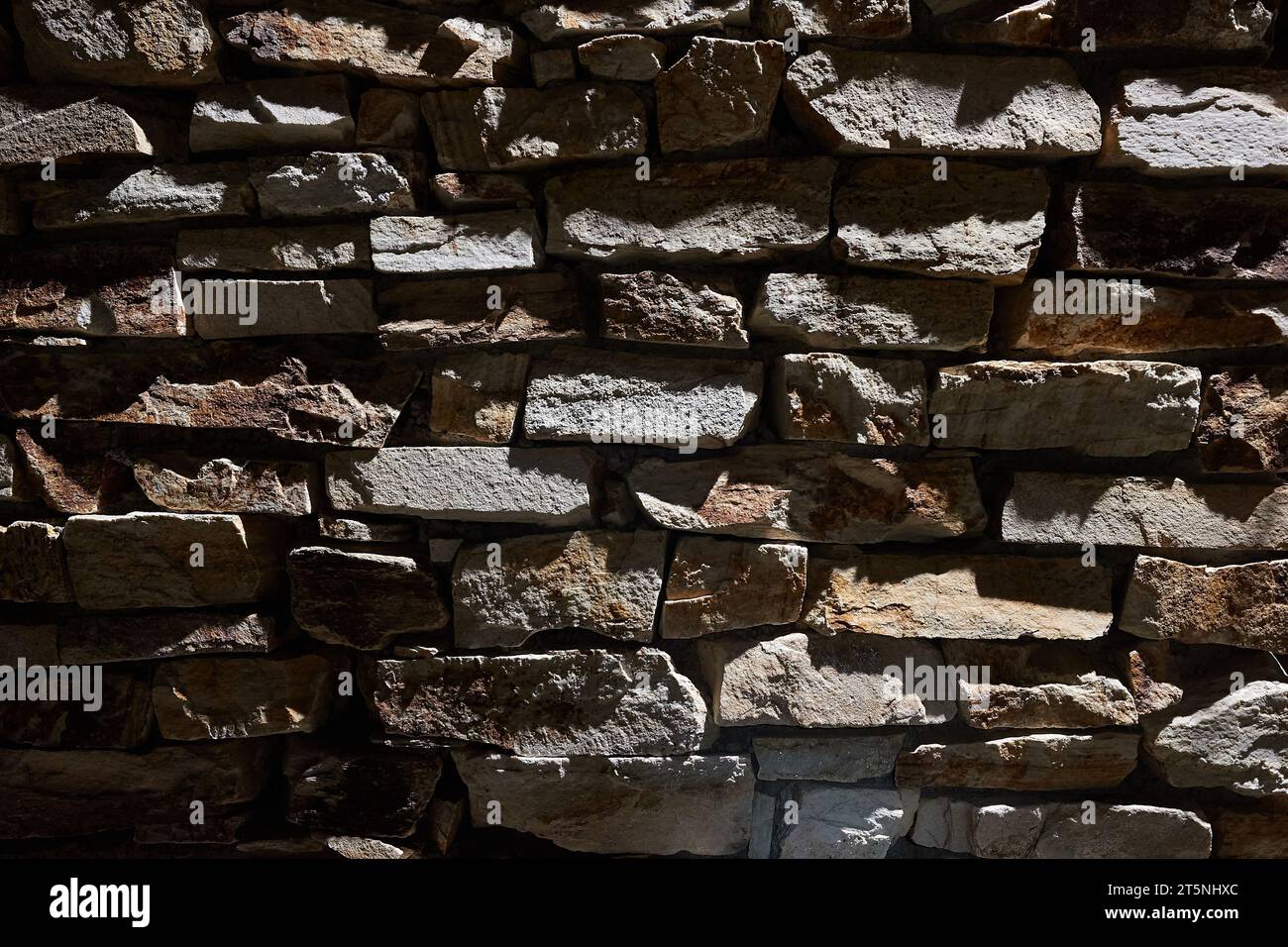 Stone wall of building in night darkness Stock Photo - Alamy