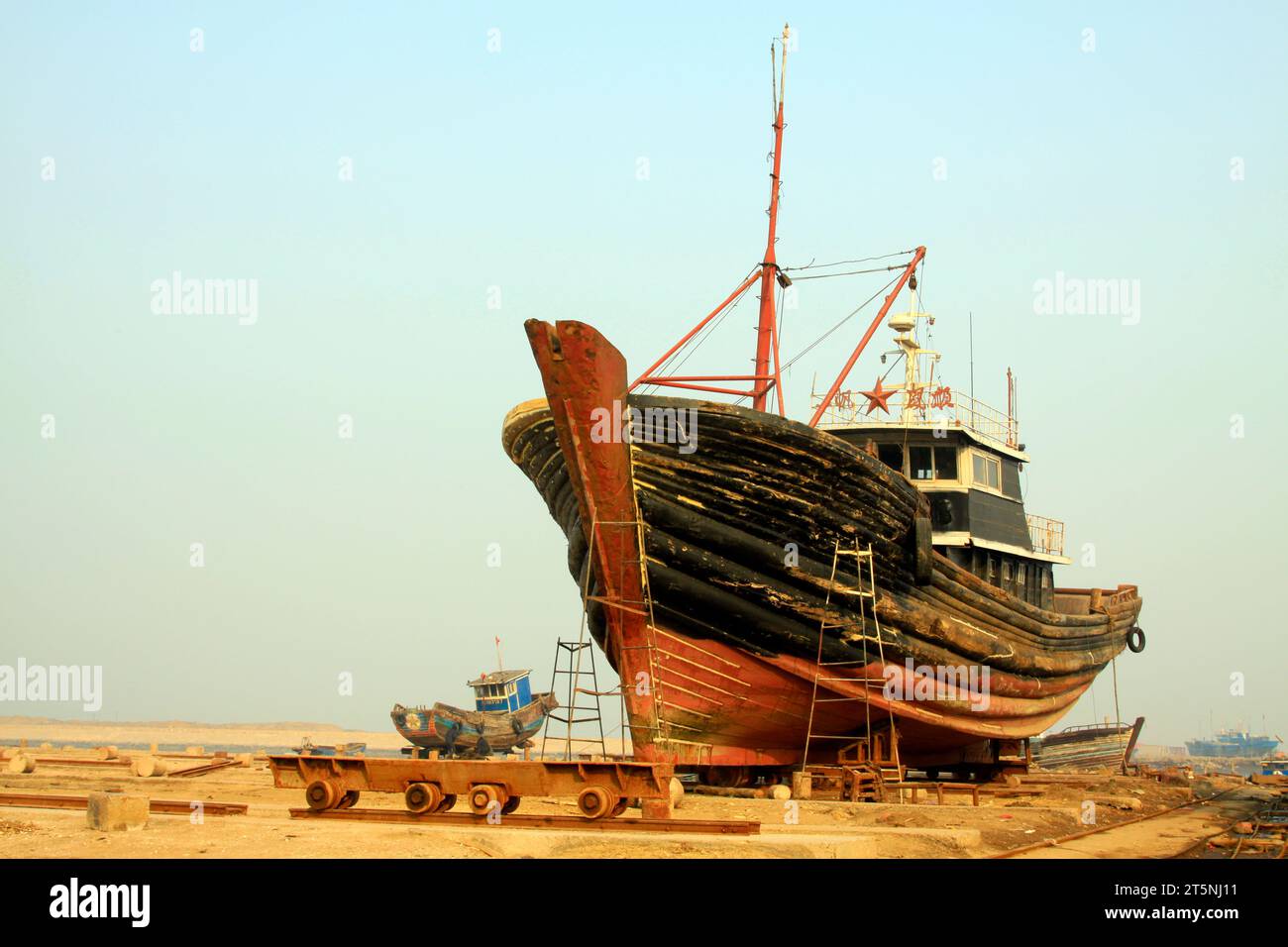 fishing boats waiting for repair, closeup of photo Stock Photo - Alamy