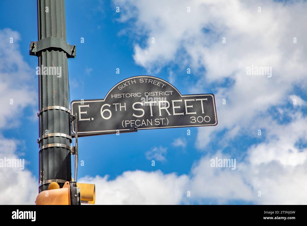 street sign 6th street - pecan street - in Austin, Texas, historic ...