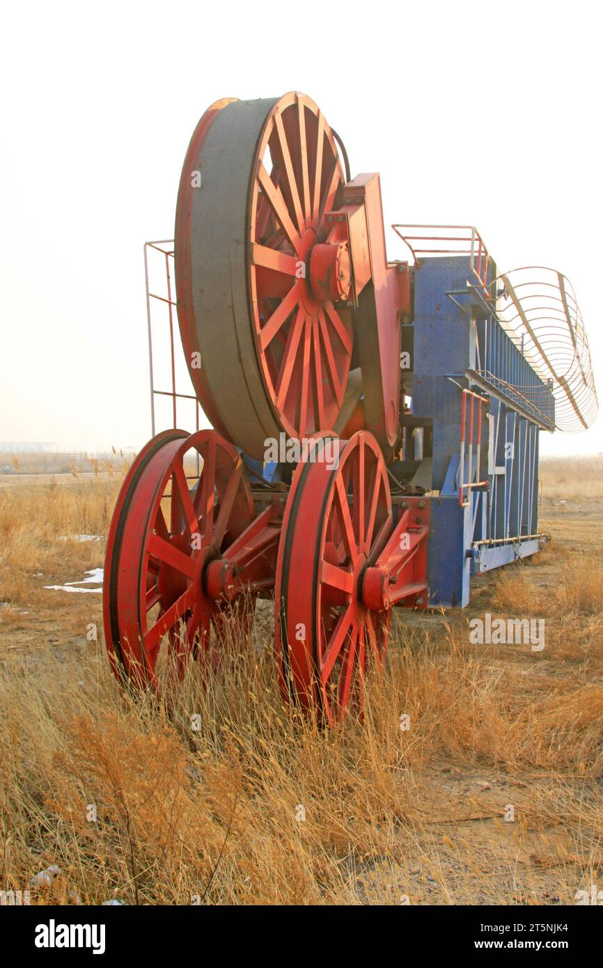 Tower type pumping unit wheel bracket in the desert, closeup of photo ...