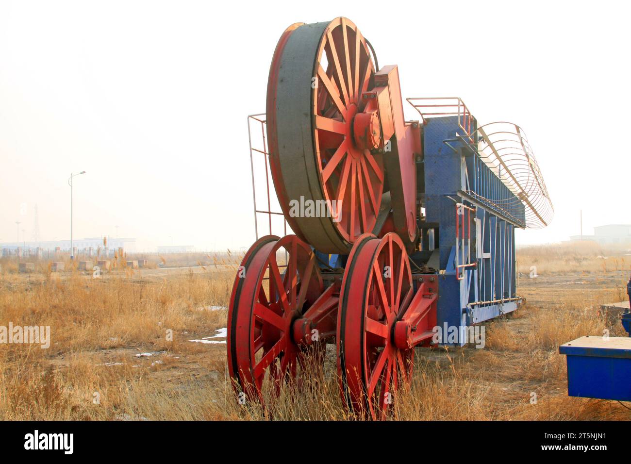 Tower type pumping unit wheel bracket in the desert, closeup of photo ...