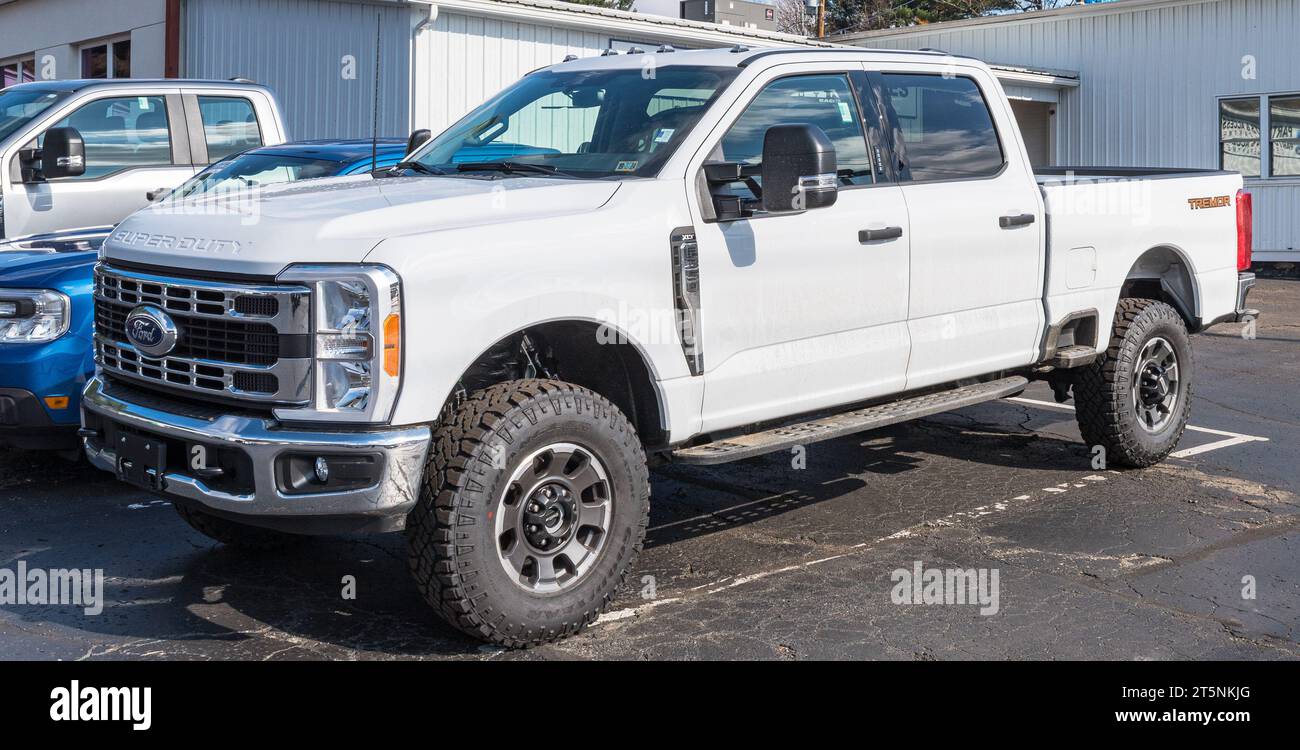 A new, white Ford Super Duty F350 four door pickup truck for sale at a ...