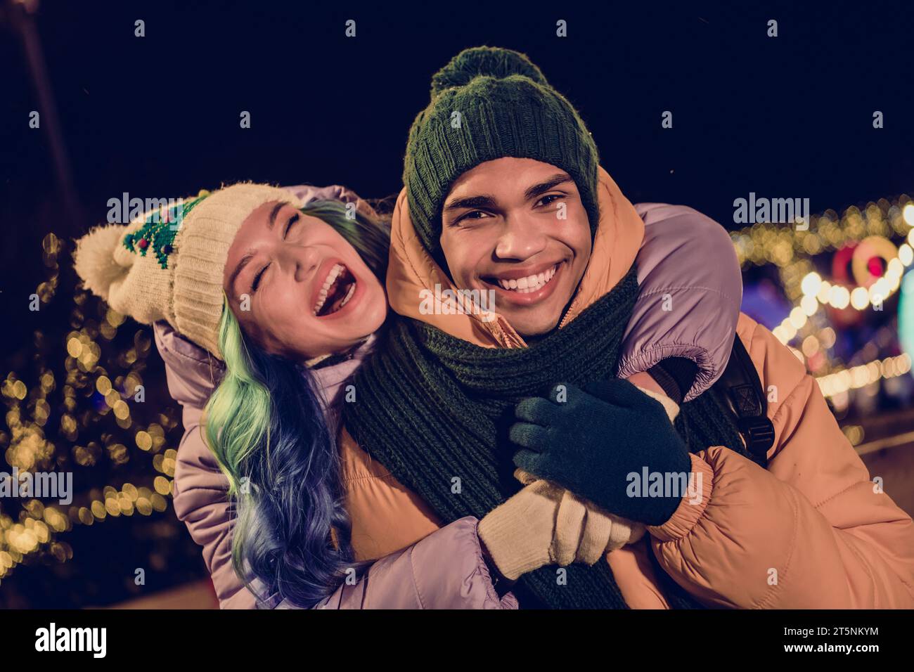 Photo of positive funny african guy lady dressed coats having fun ...