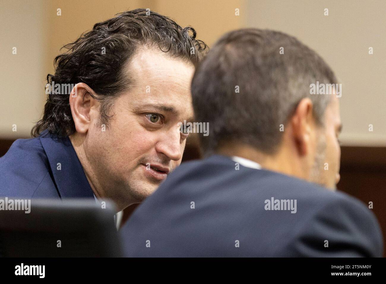 Charlie Adelson whispers with his defense attorney Daniel Rashbaum ...