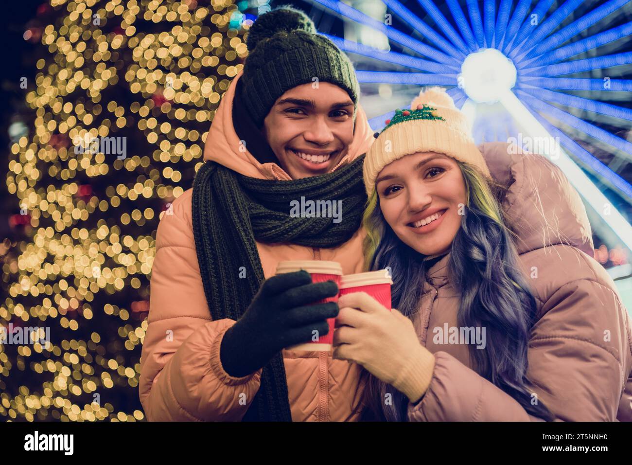 Photo of cute adorable african guy lady dressed coats drinking x-mas ...