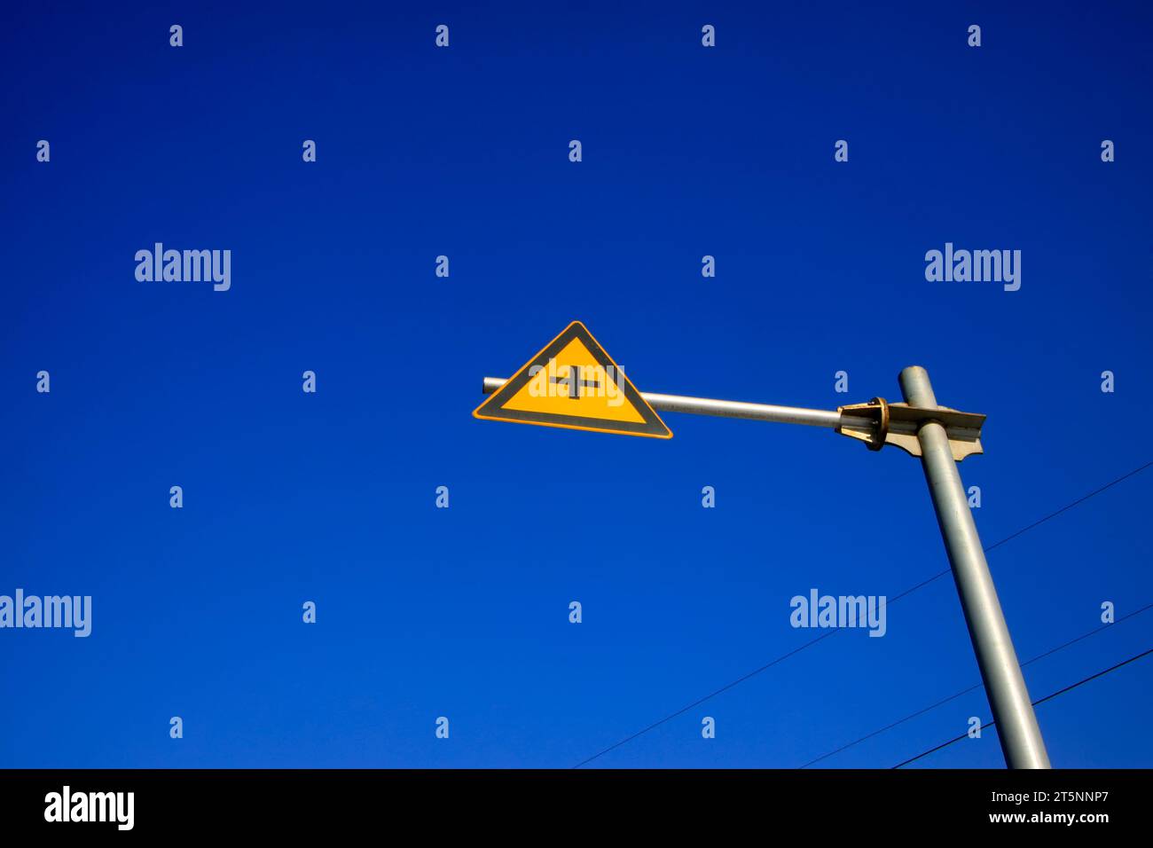 crossroads traffic signs in blue sky, closeup of photo Stock Photo - Alamy