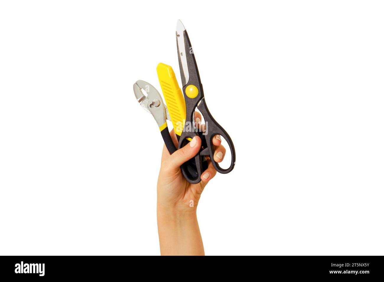 Scissors, pliers and a knife for cutting paper in hand on white ...