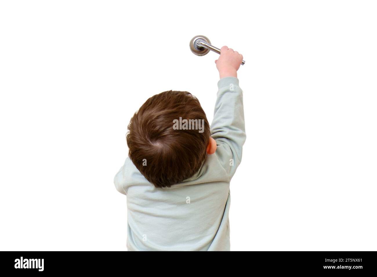 Little baby opens the door, isolated on white background. Child pulls ...
