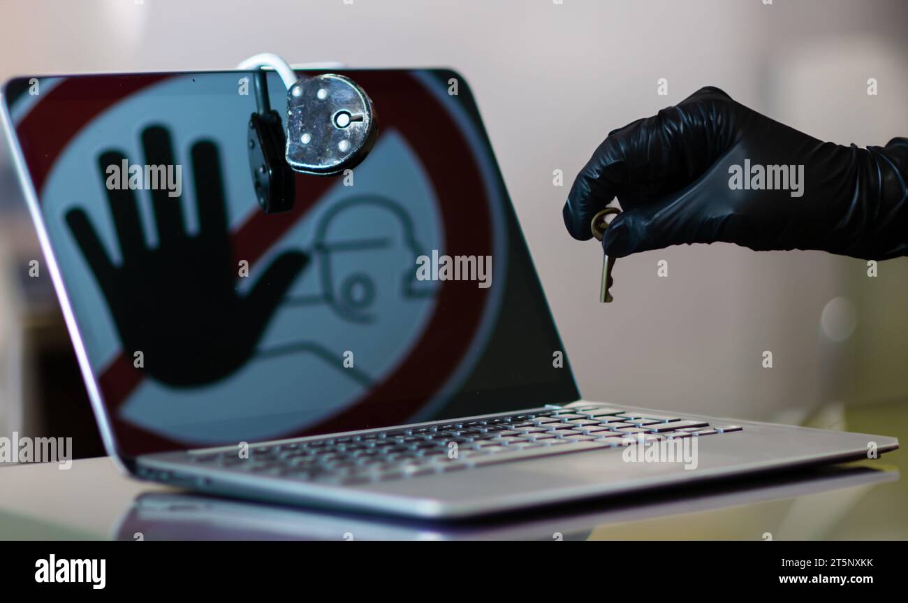 Symbol for the thread of cyber crime. Hand with glove and key reaches ...