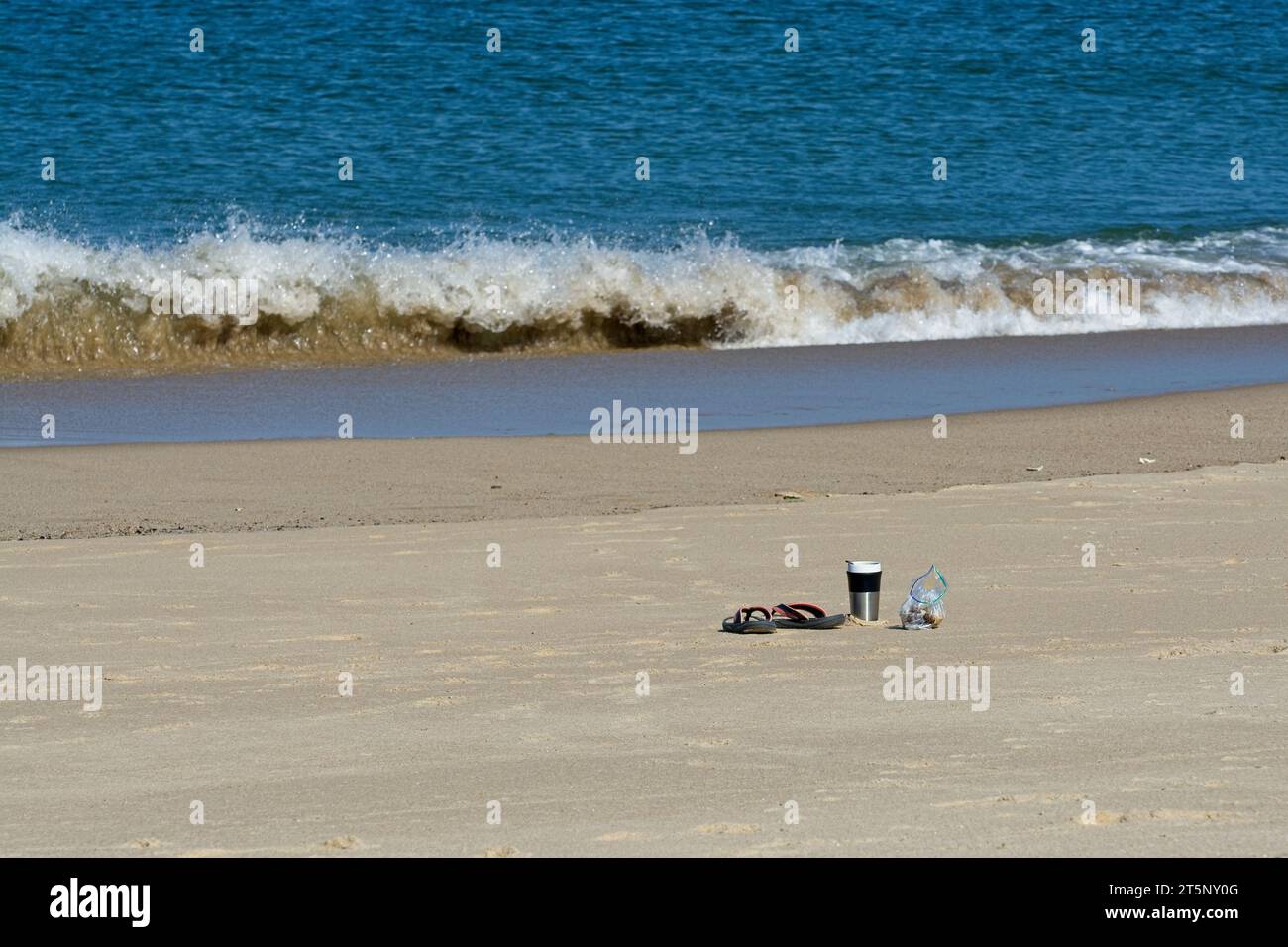 Sandals and provisions left on Cape Cod National Seashore beach above ...