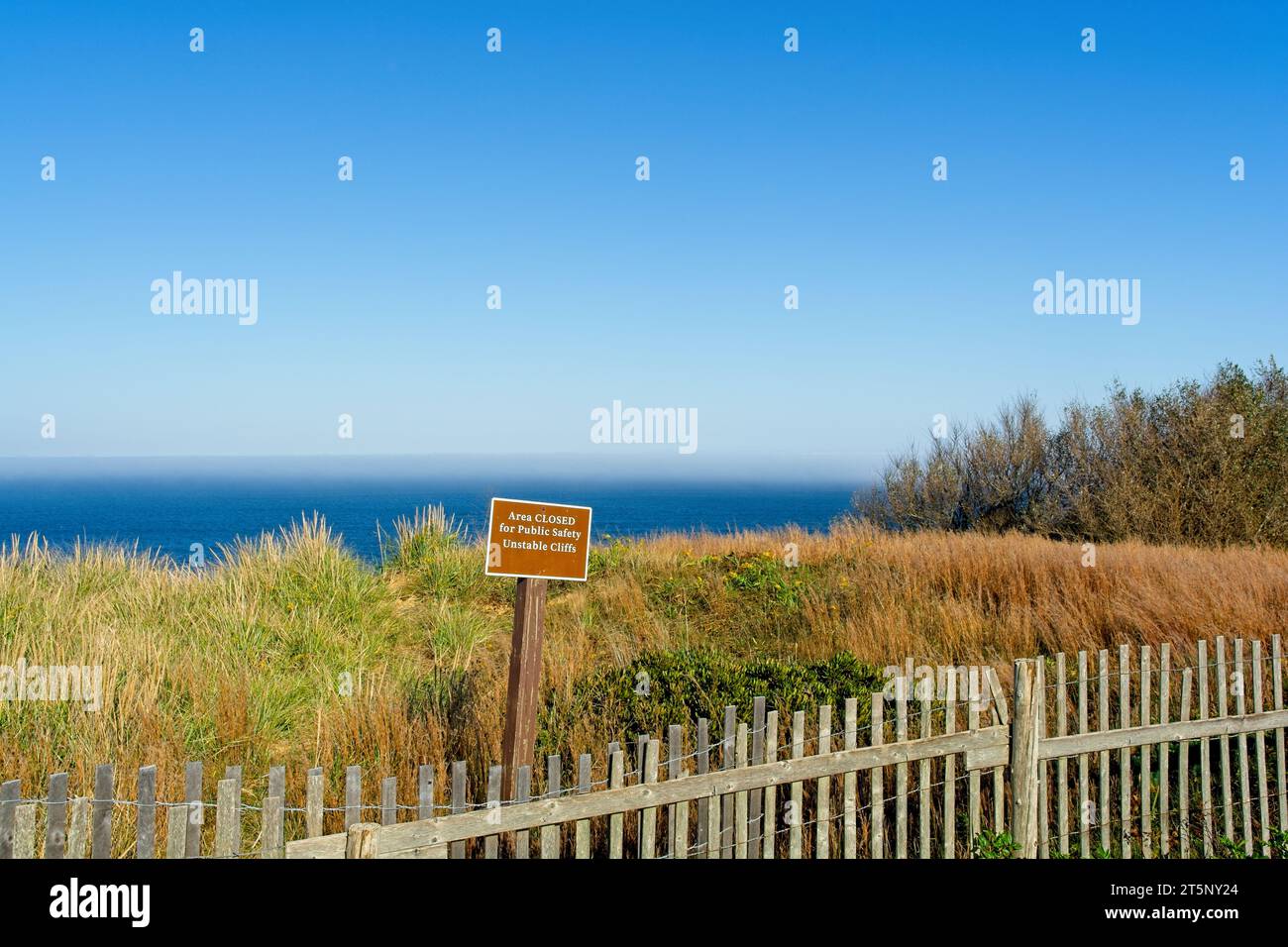 Sand fence on Cape Cod National Seashore bluff, unstable cliffs warning ...