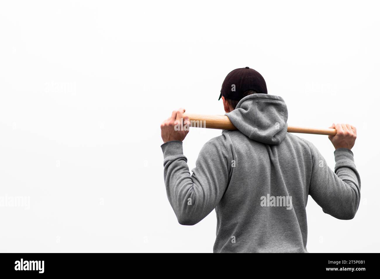 Back view man holding baseball bat shoulders Stock Photo - Alamy