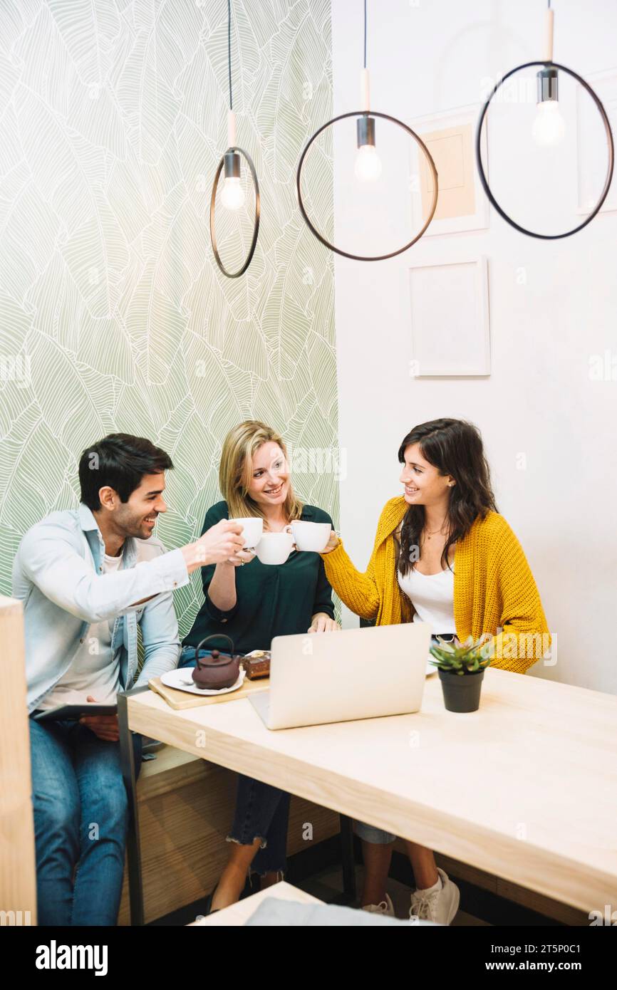 Mugs clinking hi-res stock photography and images - Alamy