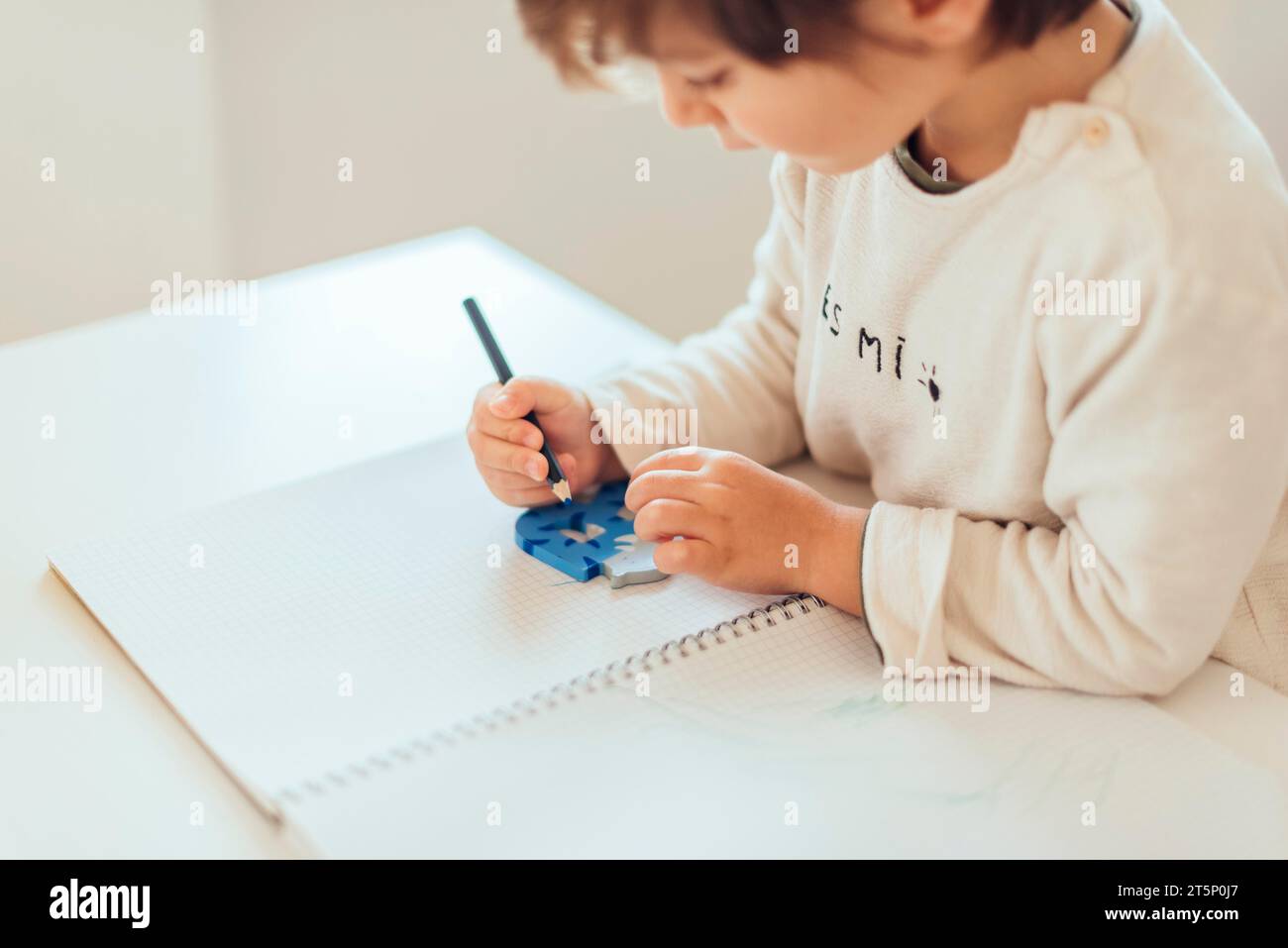 Kid doing homework Stock Photo - Alamy