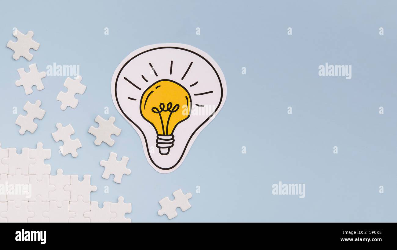Light bulb puzzle pieces with copy space Stock Photo - Alamy