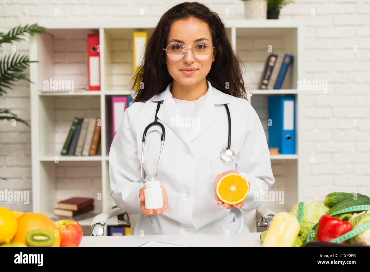 Medium shot doctor with stethoscope orange Stock Photo - Alamy