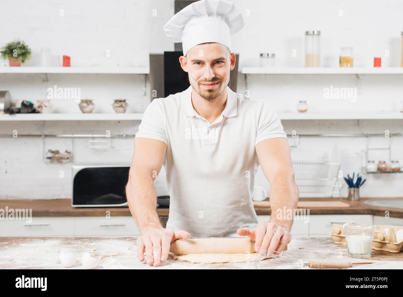 Man making pizza dough Stock Photo - Alamy