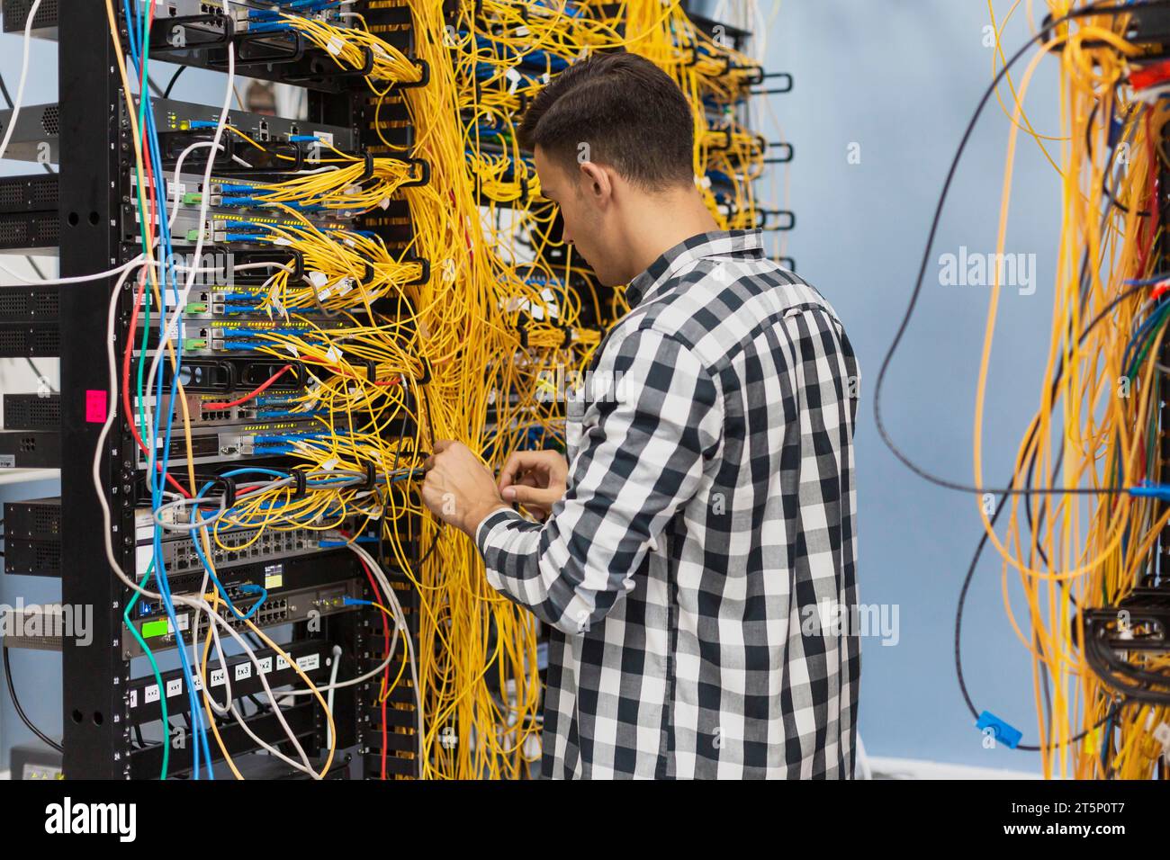 Man working ethernet switch Stock Photo - Alamy