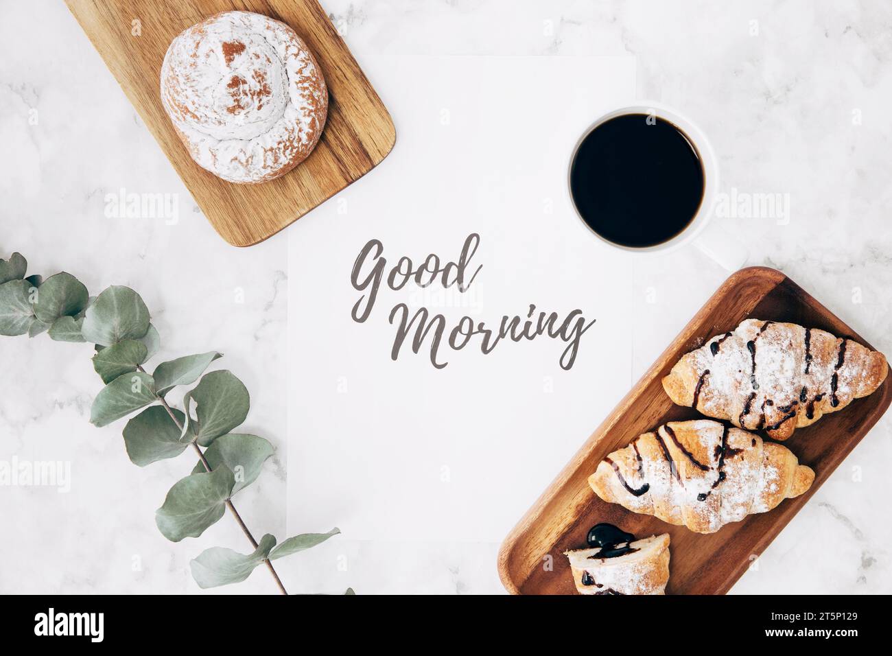 Overhead view twig coffee bun croissants with good morning message ...