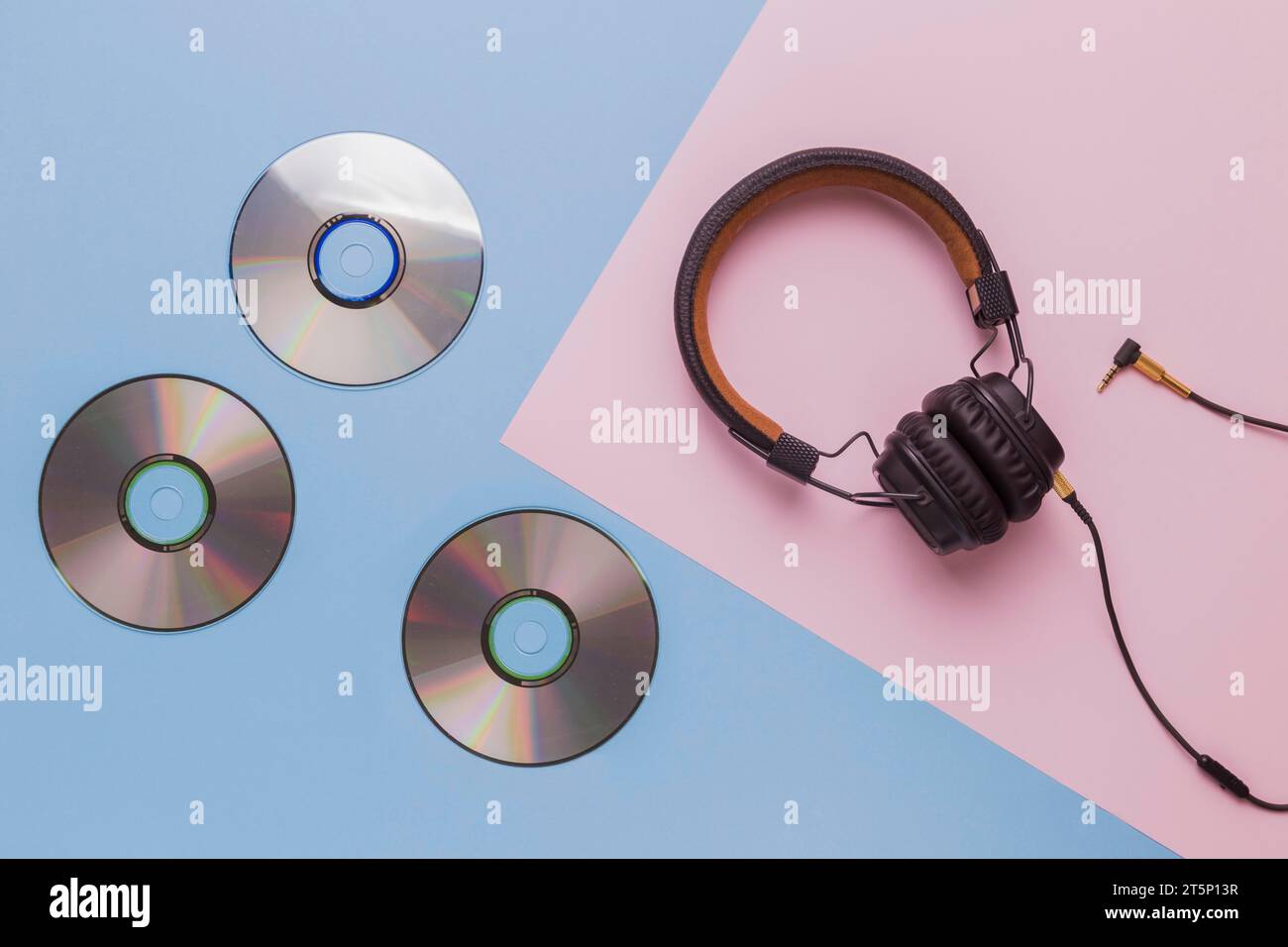 Music cds with headphones Stock Photo - Alamy