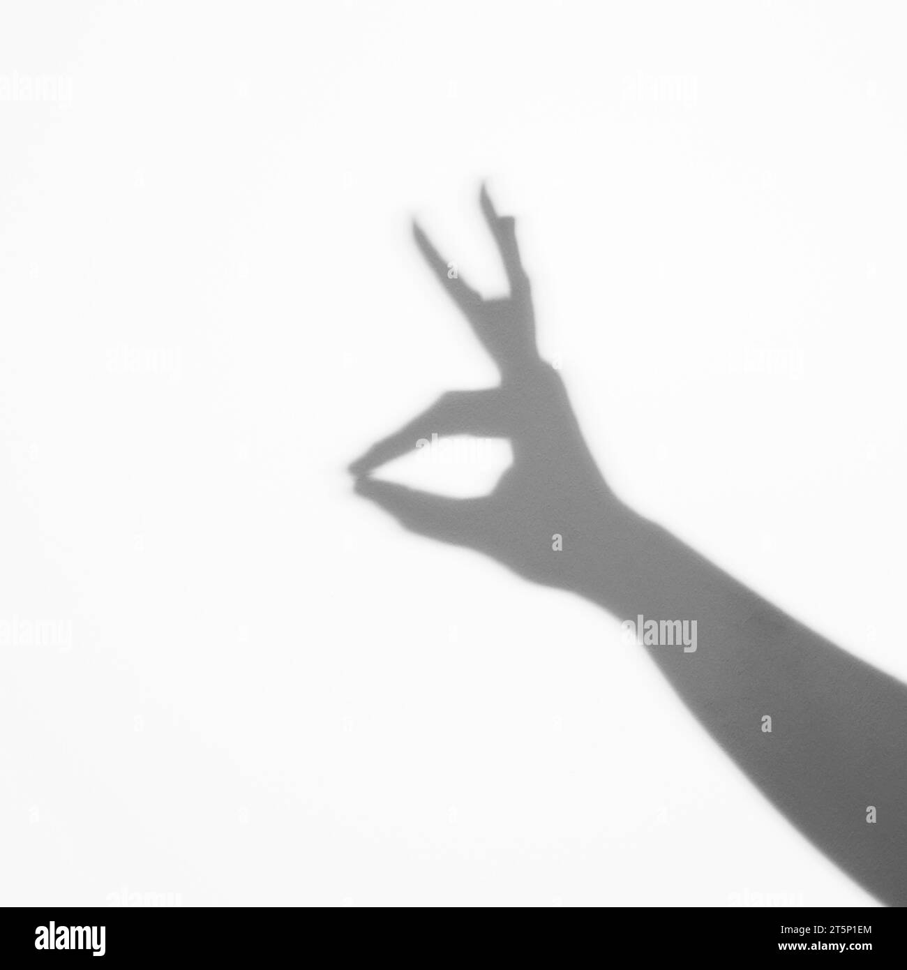 Shadow made with human finger hands white backdrop Stock Photo - Alamy