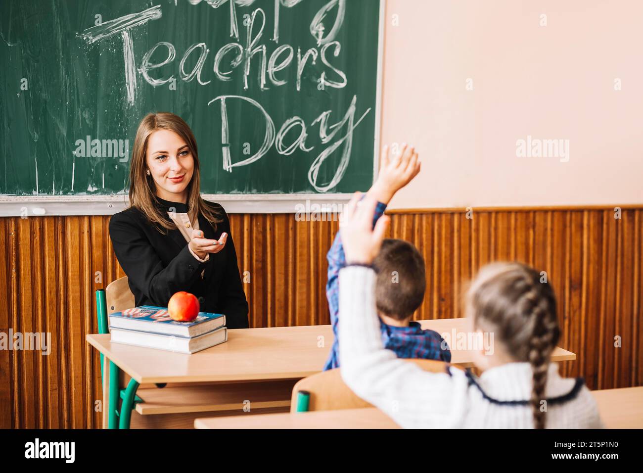 Pupils teacher reading book hi-res stock photography and images - Alamy