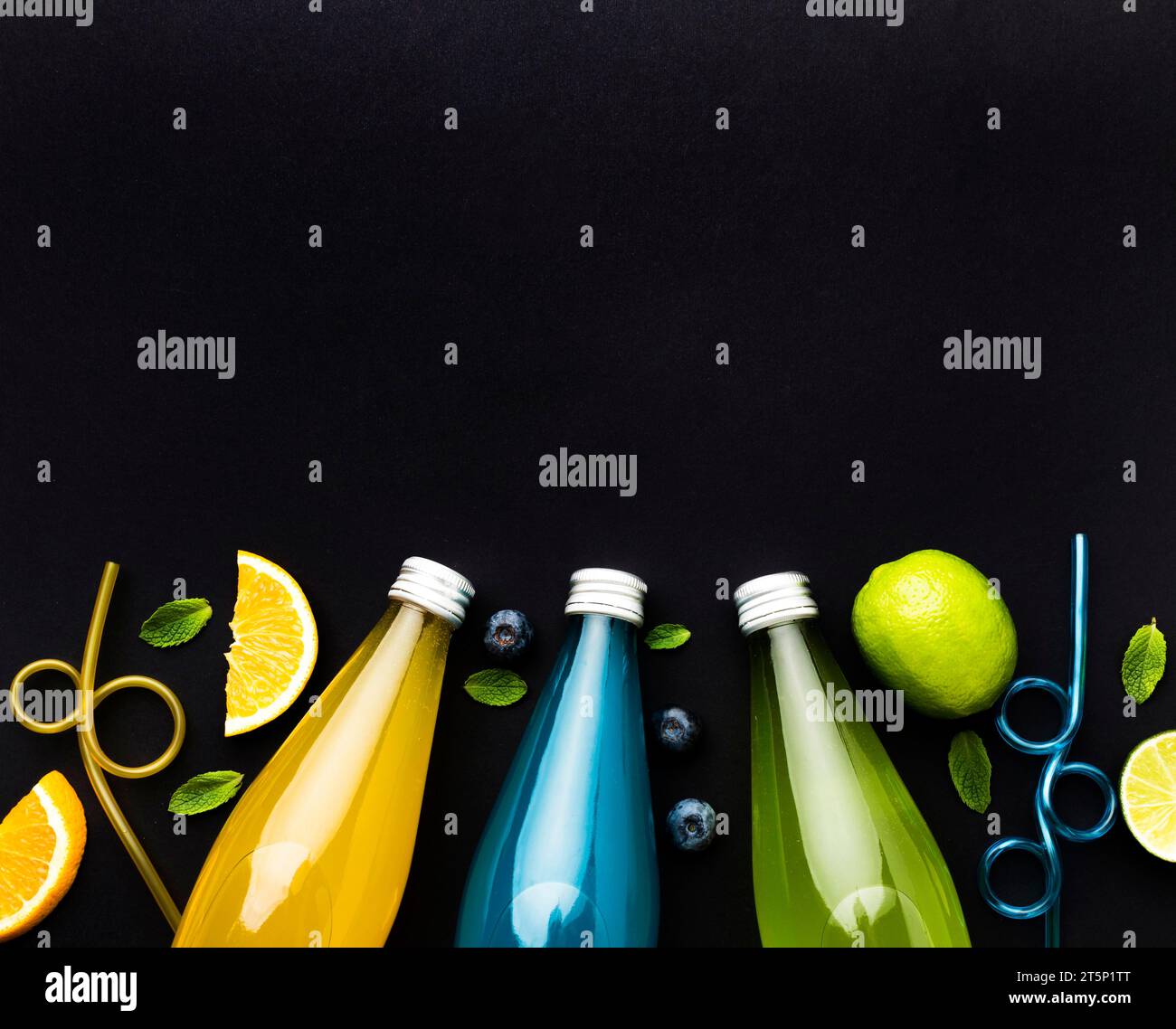 Top view bottles with soft drinks fruits Stock Photo - Alamy