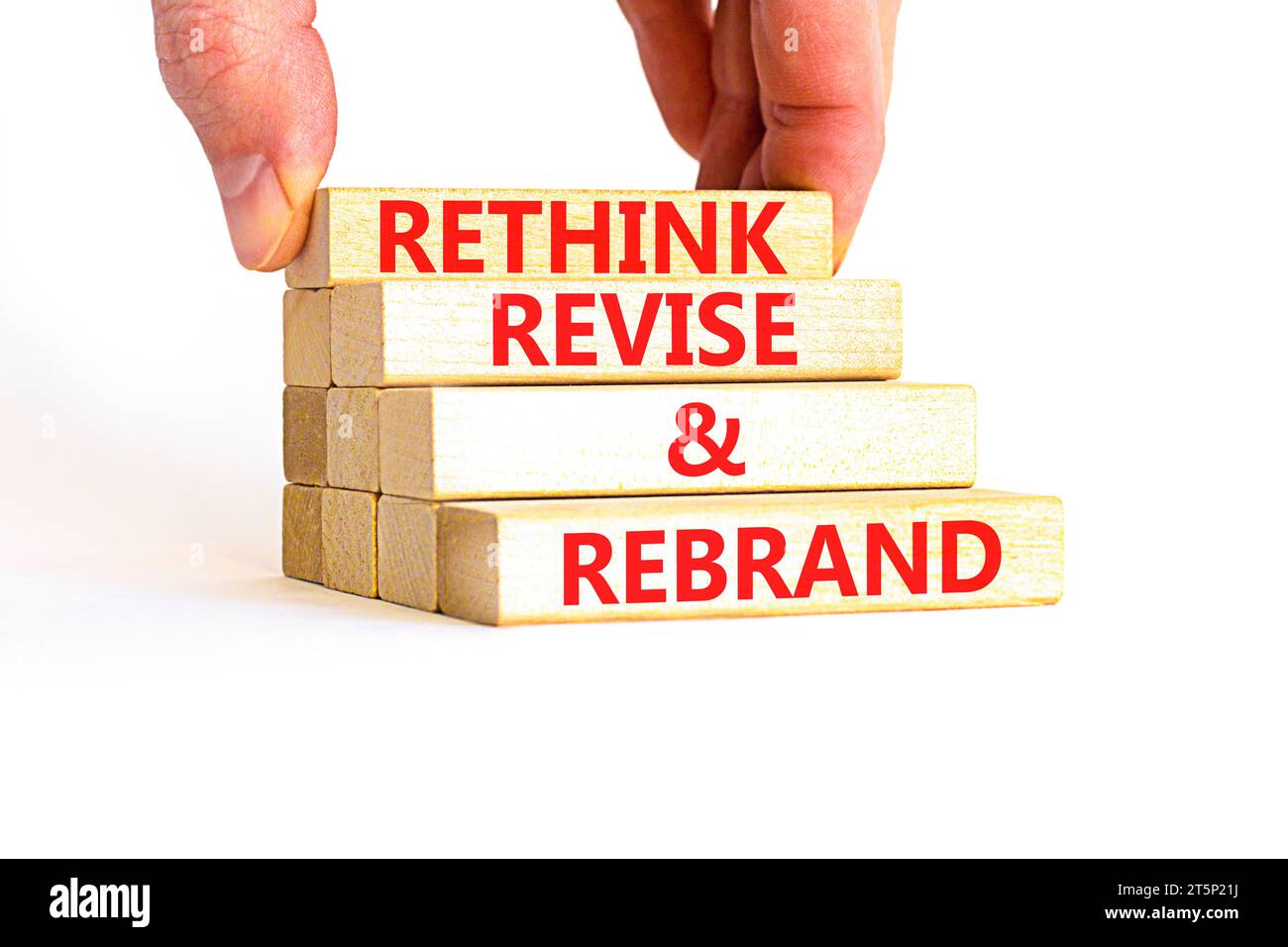 Rethink revise rebrand symbol. Concept word Rethink Revise and Rebrand on beautiful block ...