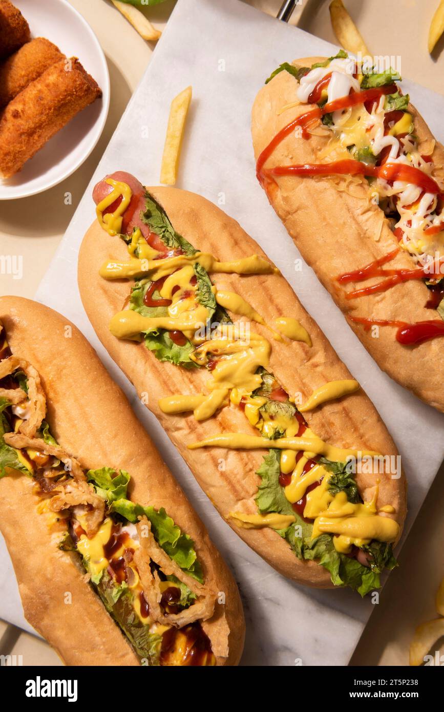 Top view three different hot dogs with filling Stock Photo - Alamy