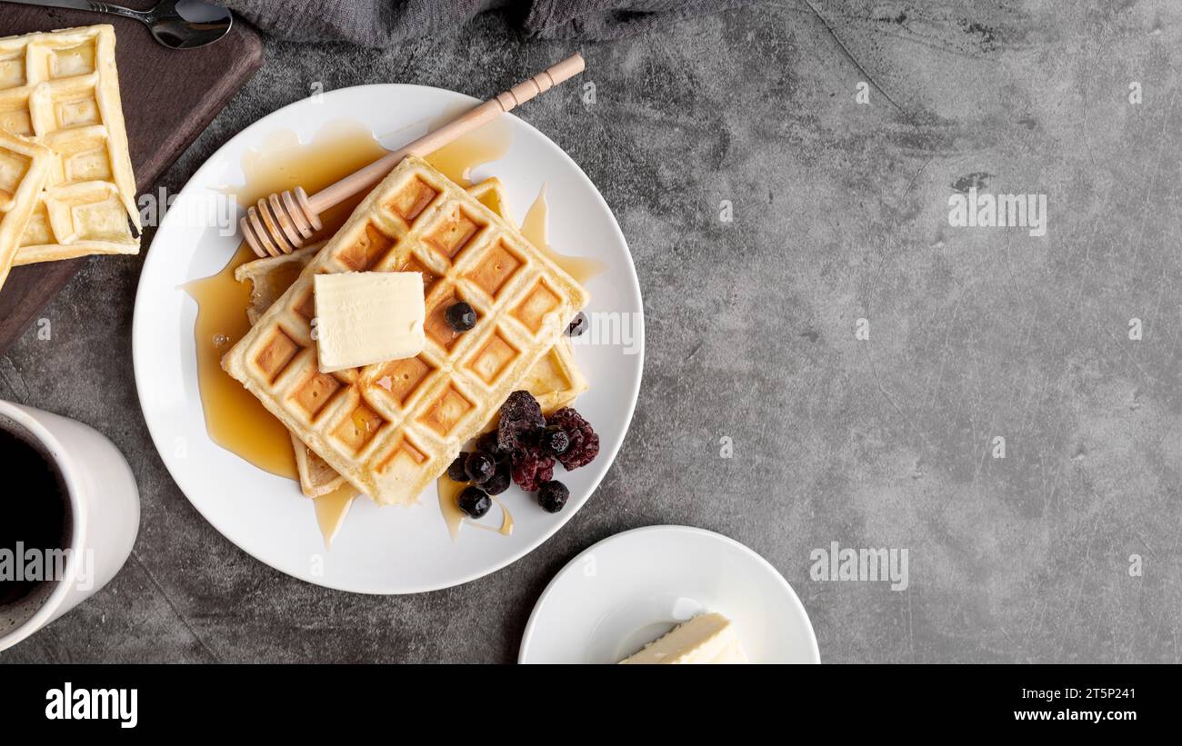 Top view waffles plate with butter honey Stock Photo - Alamy