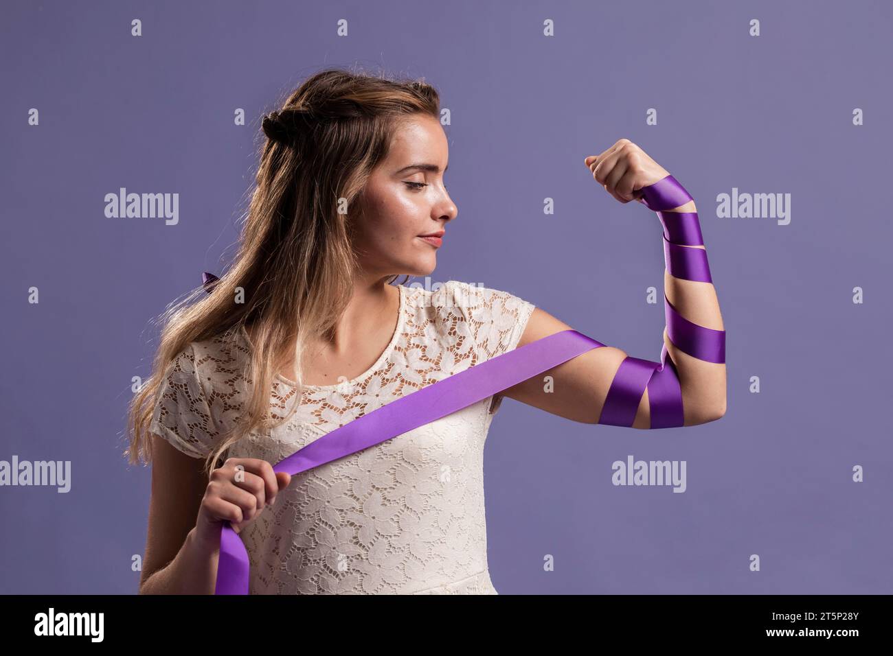 Woman flexing arm hi-res stock photography and images - Alamy
