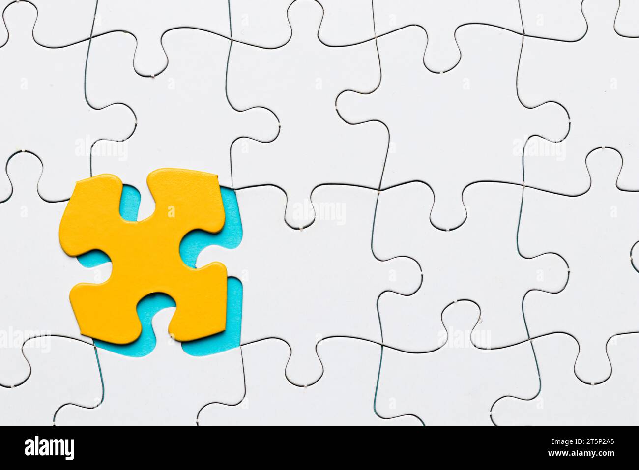 White puzzle grid with yellow puzzle piece backdrop Stock Photo - Alamy