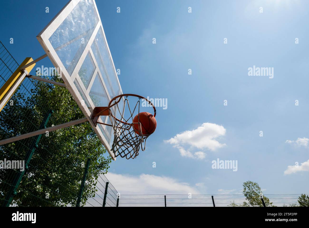 Basketball ball hoop low angle shot Stock Photo - Alamy