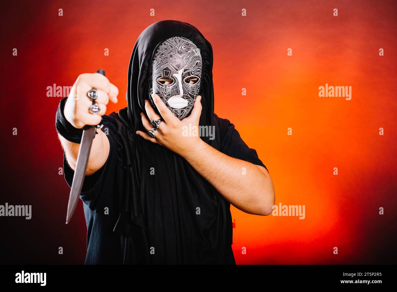 Assassin with knife red Stock Photo - Alamy
