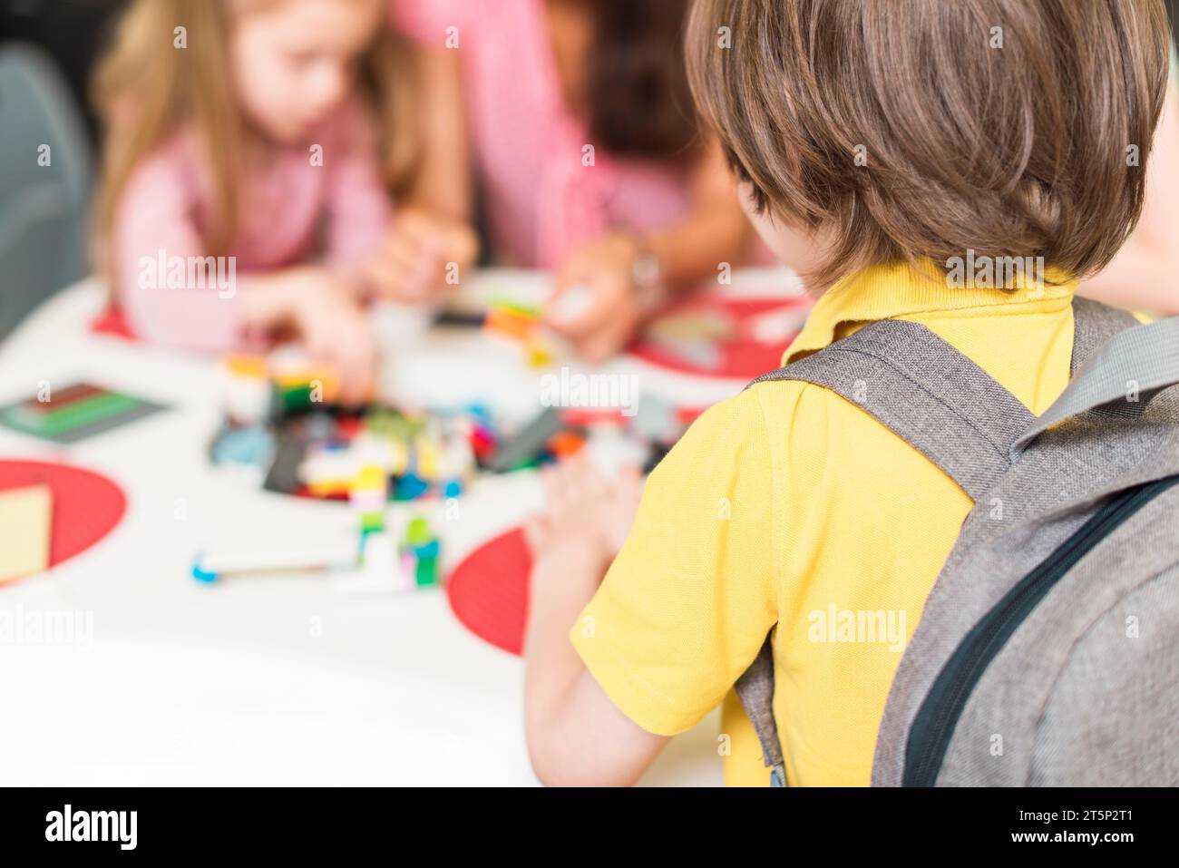 Back view kid with backpack Stock Photo - Alamy