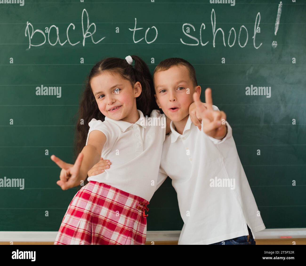 Cheerful boy girl blackboard Stock Photo - Alamy Cheerful boy girl blackboard Stock Photo - Alamy