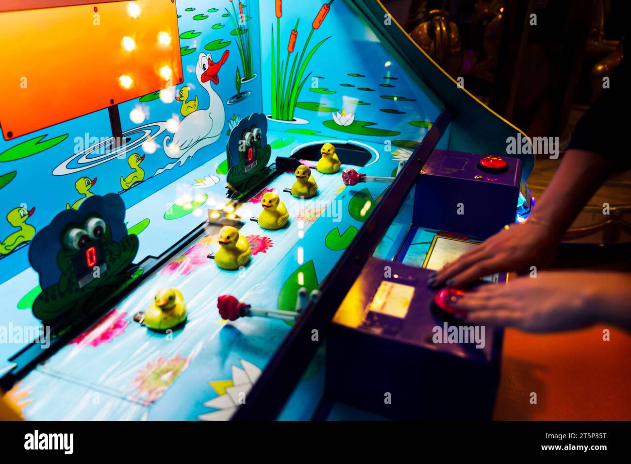 Close up arcade game with rubber ducks Stock Photo - Alamy