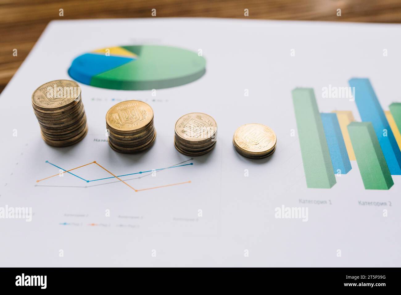 Close up stacked coins graph chart Stock Photo - Alamy