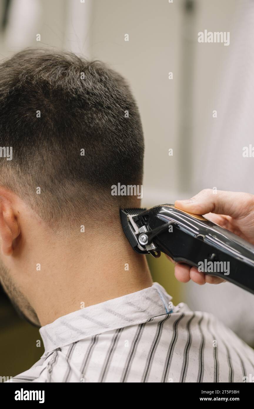 Man getting haircut hairdresser modern hi-res stock photography and ...