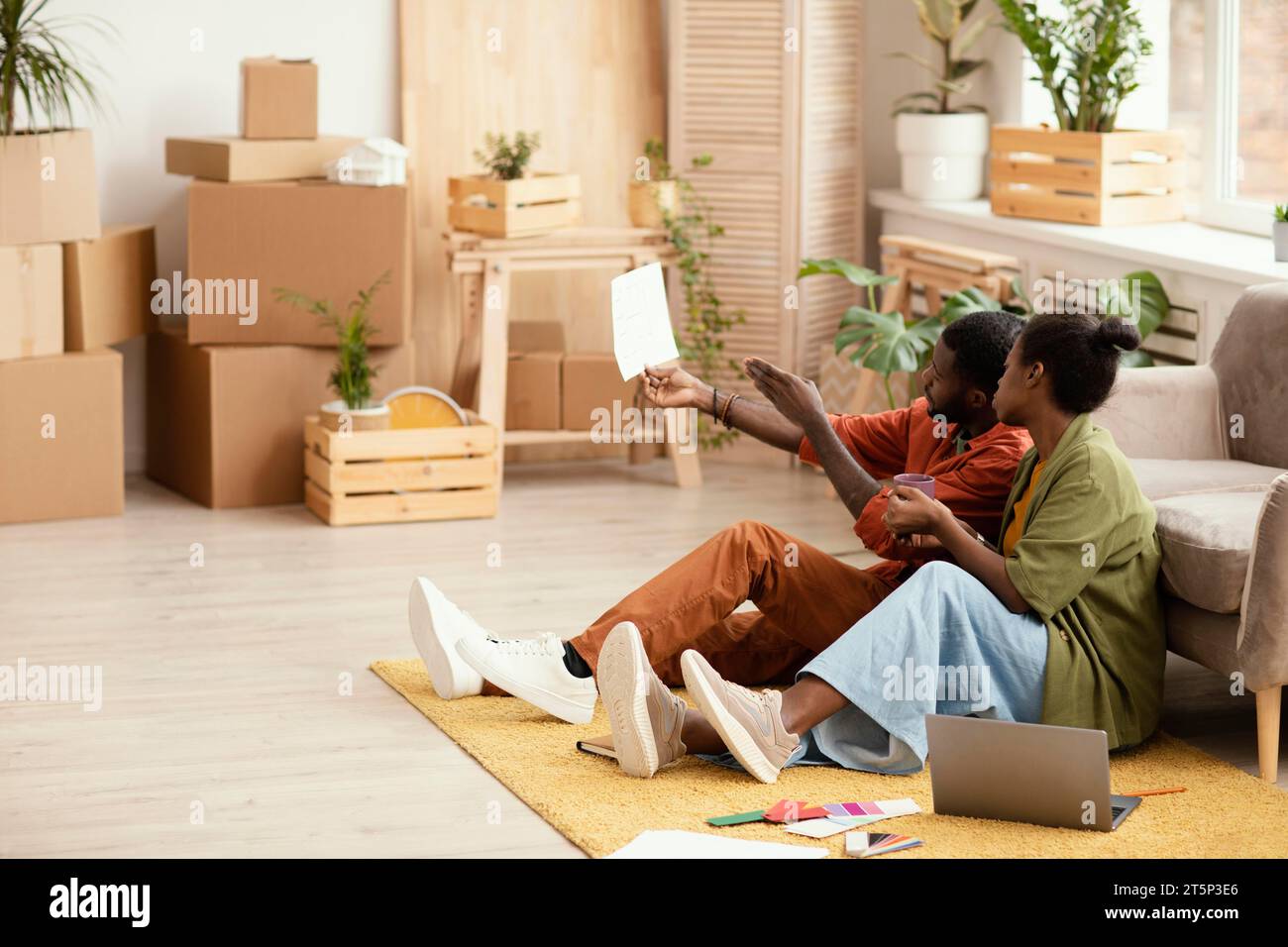 Couple making plans together renovating home Stock Photo - Alamy