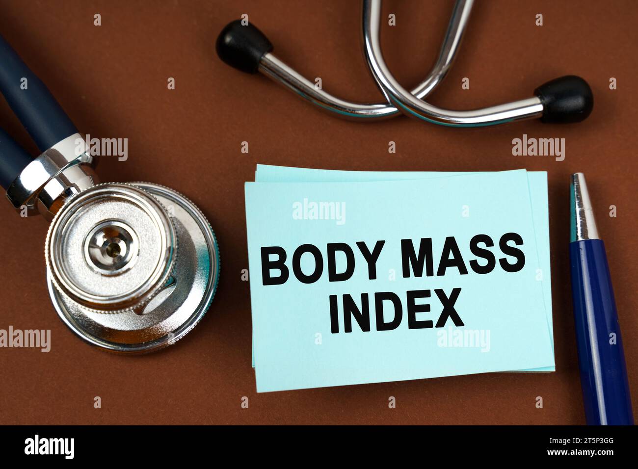 Medical concept. On a brown surface there is a stethoscope, a pen and ...