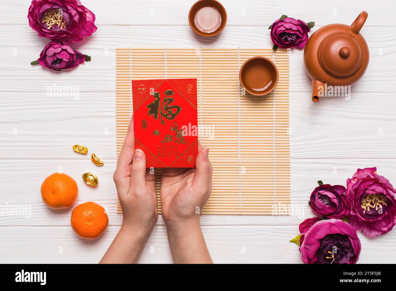 Crop hands holding chinese card Stock Photo - Alamy