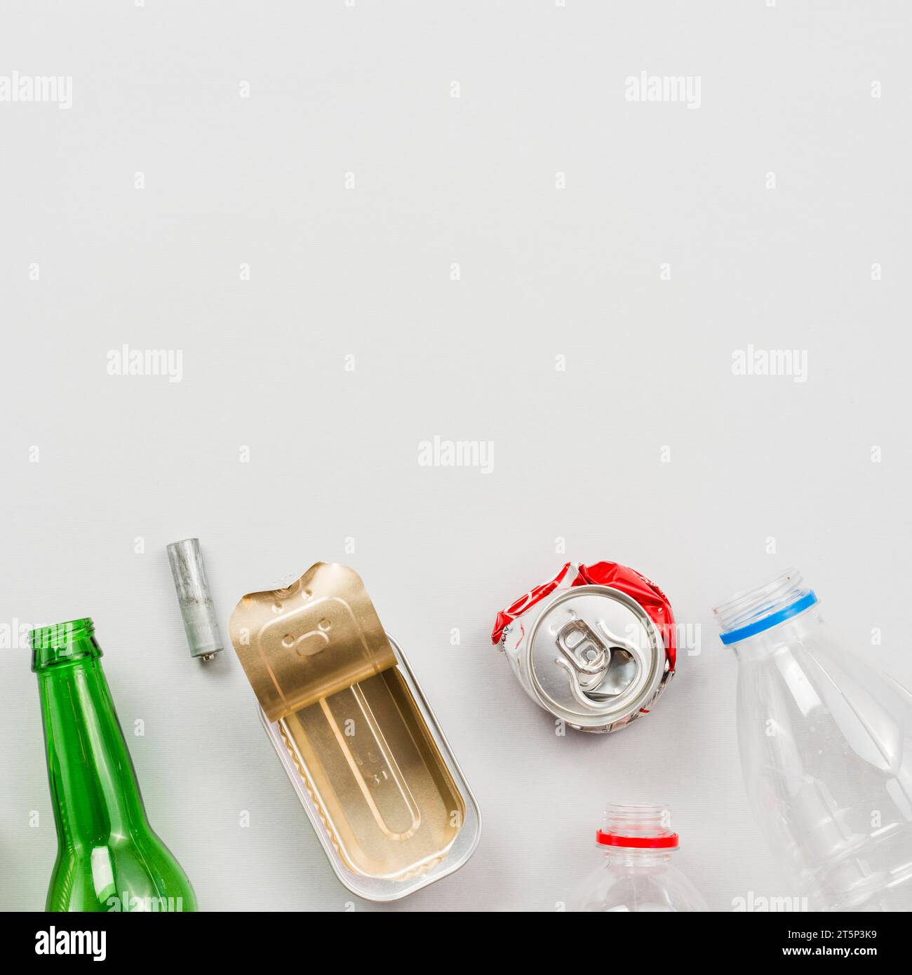 Different recyclable waste white background Stock Photo - Alamy