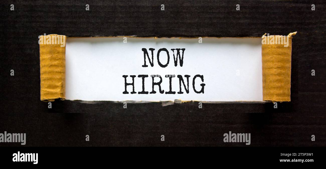 Now hiring symbol. Concept words Now hiring on beautiful white paper ...
