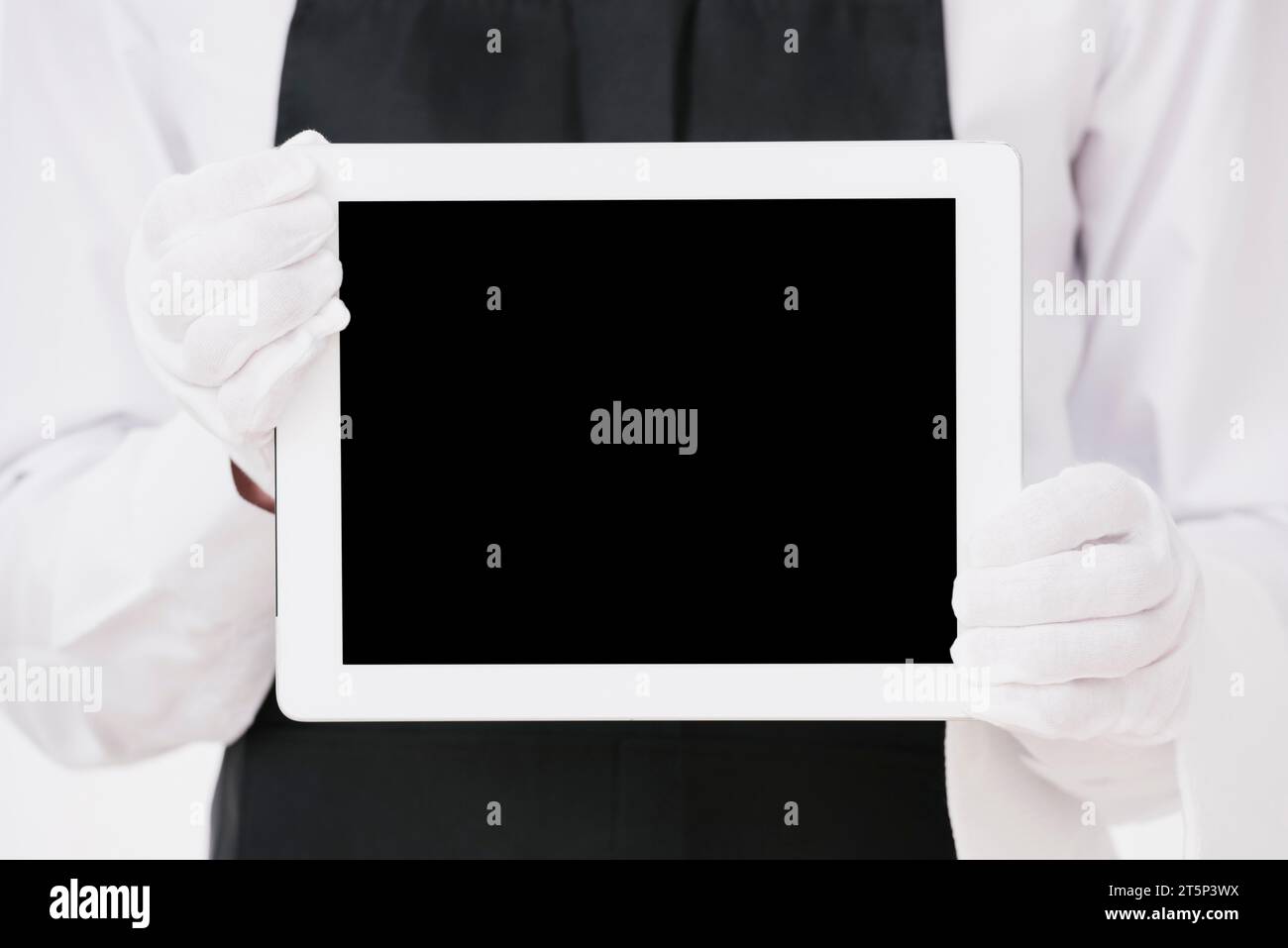 Elegant waiter holding tablet mock up Stock Photo - Alamy