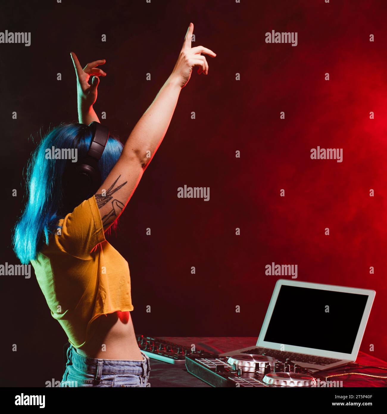 Female dj club mixing entertaining crowd Stock Photo - Alamy