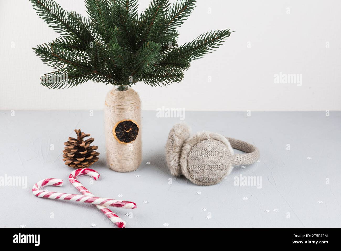 Fir tree branches vase with candy canes Stock Photo - Alamy