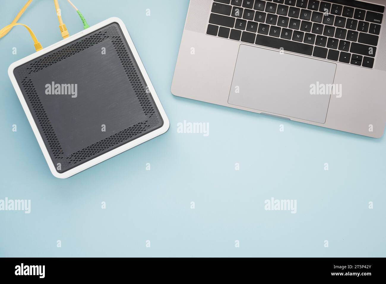 Flat lay desk with laptop wireless router Stock Photo - Alamy